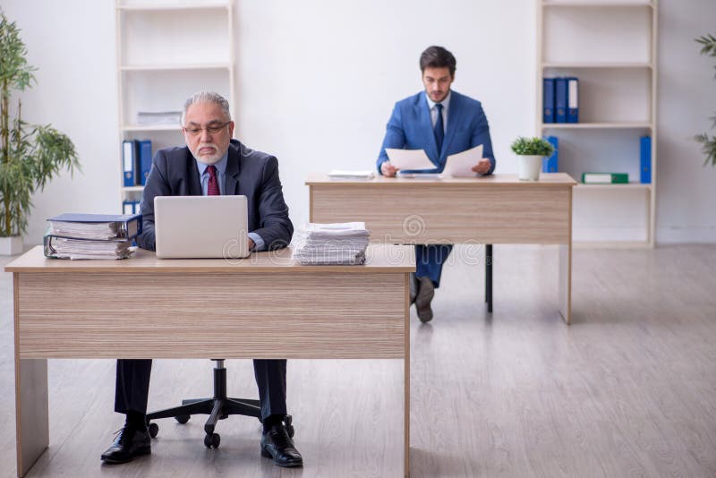 Two Male Colleagues Working in the Office Stock Photo - Image of ...