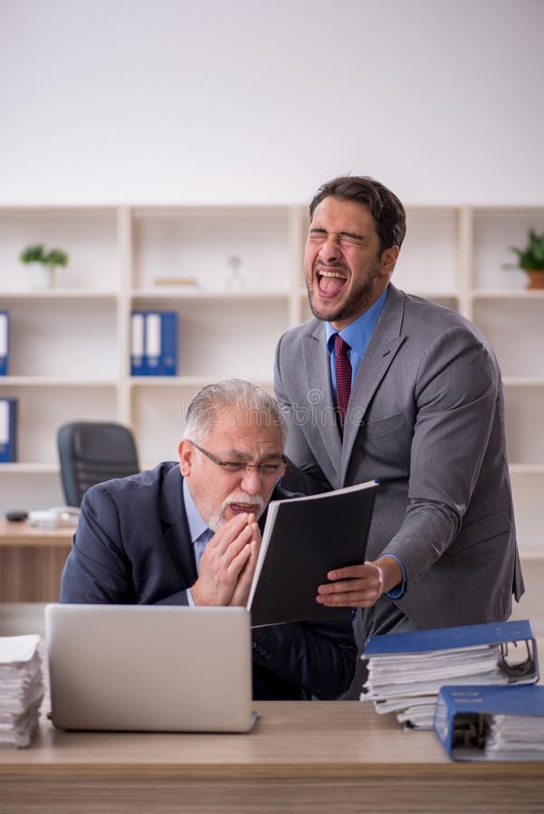 Two Male Colleagues Working in the Office Stock Image - Image of pile ...