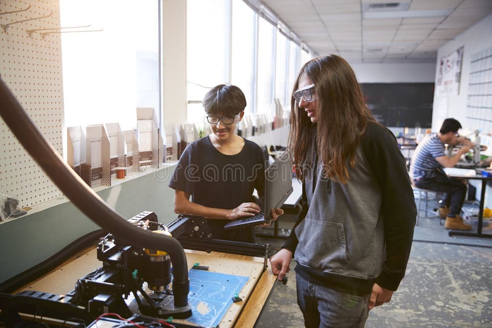 Two Male College Students Work on Computer Controlled Rig in Science ...
