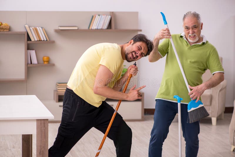 Two Male Contractors Cleaning the House Stock Image - Image of ...