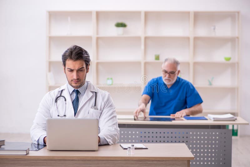 Two Male Doctors in Telemedicine Concept Stock Photo - Image of ...