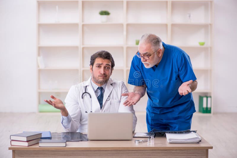 Two Male Doctors in Telemedicine Concept Stock Photo - Image of ...