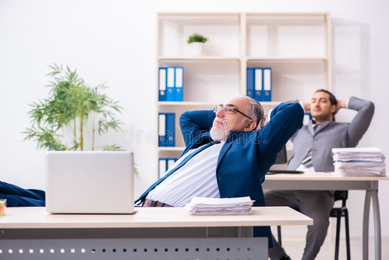 Two Male Employees Working in the Office Stock Photo - Image of ...