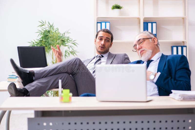 Two Male Employees Working in the Office Stock Image - Image of ...