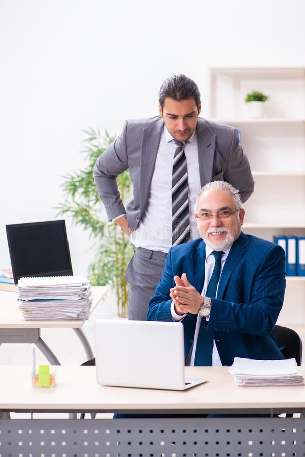 Two Male Employees Working in the Office Stock Image - Image of ...