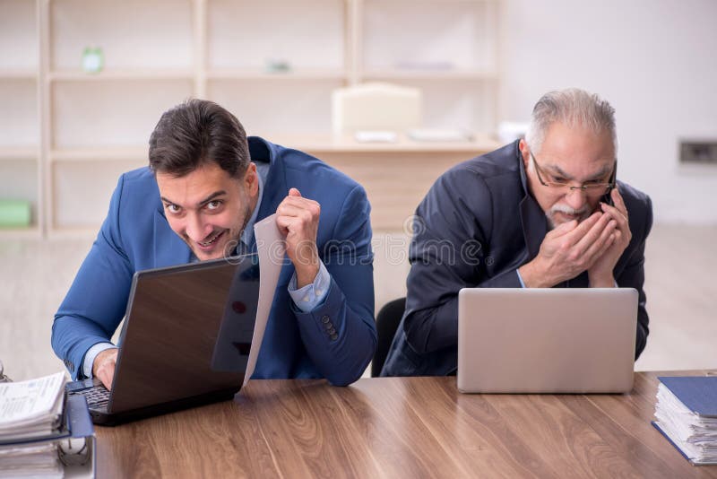 Two Male Employees Working in the Office Stock Image - Image of team ...