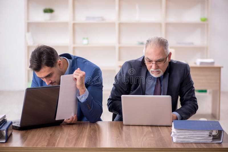 Two Male Employees Working in the Office Stock Image - Image of working ...