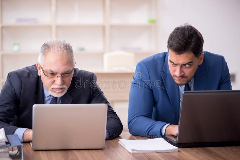 Two Male Employees Working in the Office Stock Photo - Image of ...