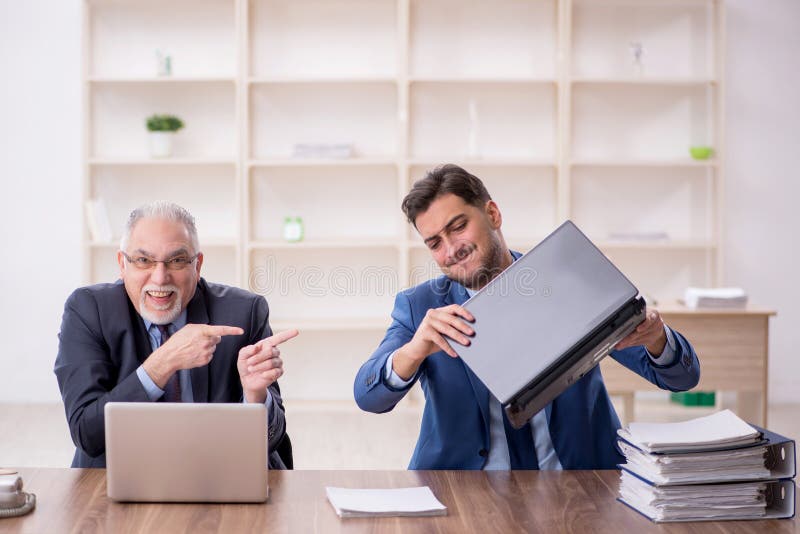 Two Male Employees Working in the Office Stock Photo - Image of ...