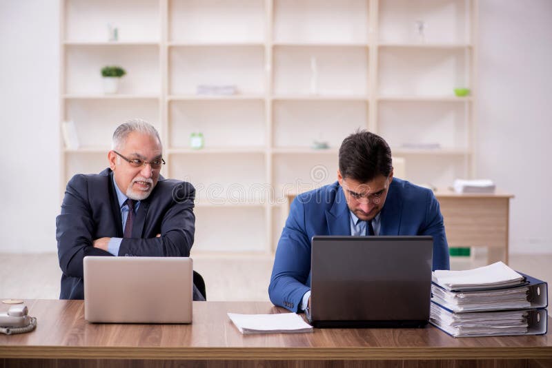 Old Male Employee Looking after New Born at Workplace Stock Image ...
