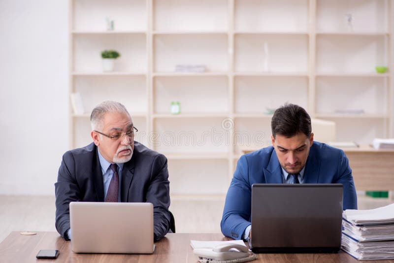 Two Male Employees Working in the Office Stock Photo - Image of young ...