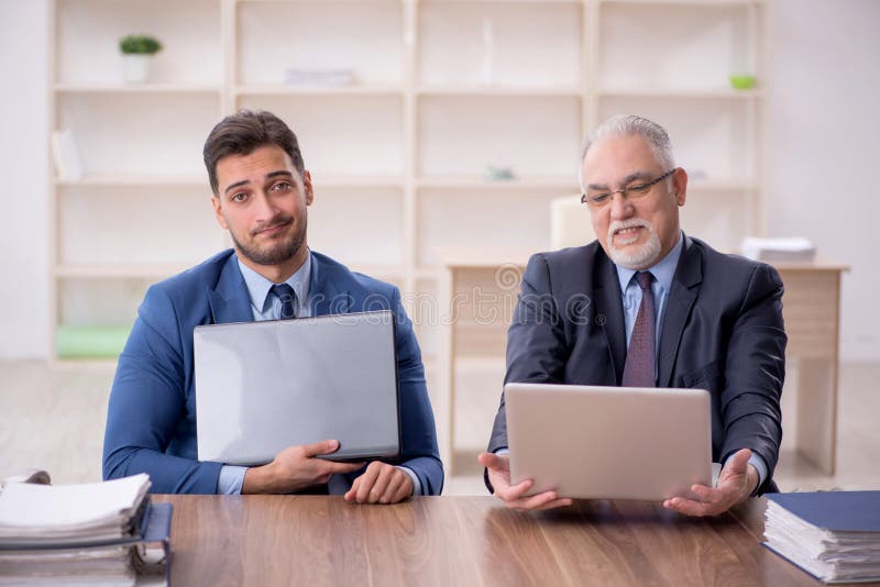 Two Male Employees Working in the Office Stock Photo - Image of desk ...