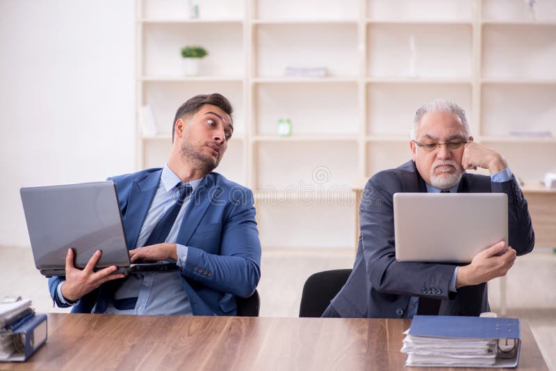 Two Male Employees Working in the Office Stock Photo - Image of ...