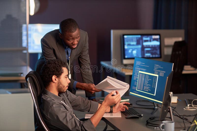 Two Male it Engineers Discussing Documentation at Workplace Stock Image ...