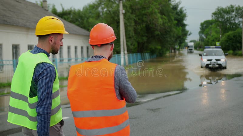 Male Engineers Solve Flood Problem. Devastation Wrought after Massive ...