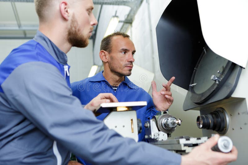 Two Male Engineers Using Equipment Stock Image - Image of learning ...