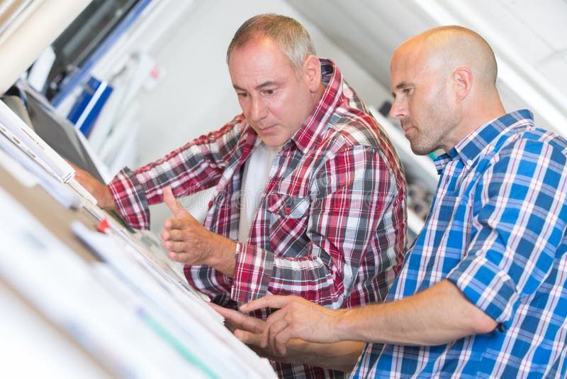 Two Male Engineers Working with New Project Stock Image - Image of male ...