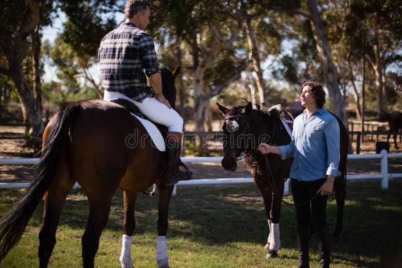Two Male Friends Interacting with Each Other in the Ranch Stock Image ...