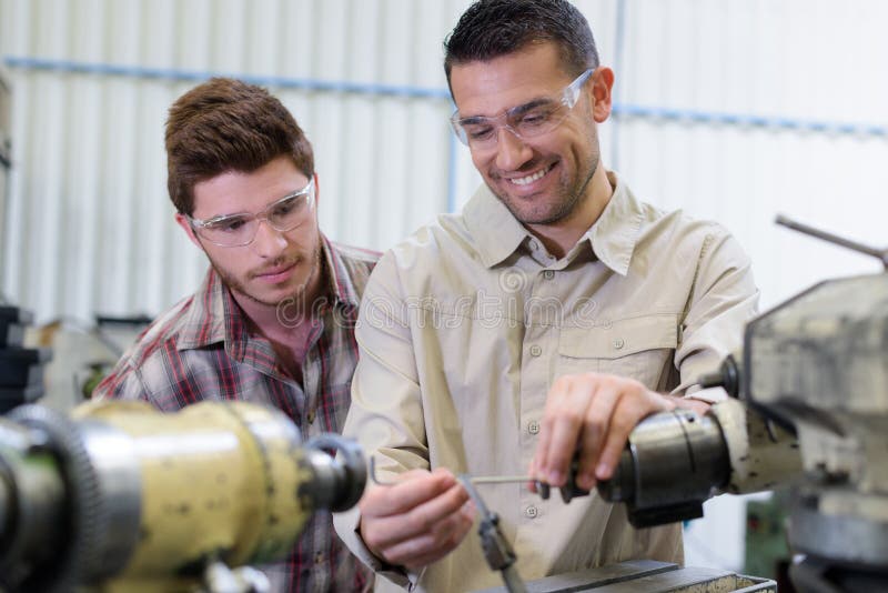 Two male machinist at work stock photo. Image of lorry - 326322280