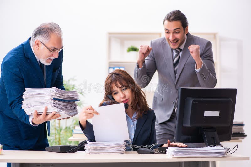 Two Male and One Female Employees Working in the Office Stock Image ...