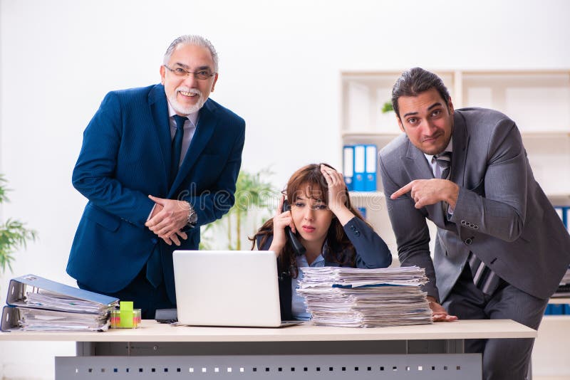 Two Male and One Female Employees Working in the Office Stock Image ...