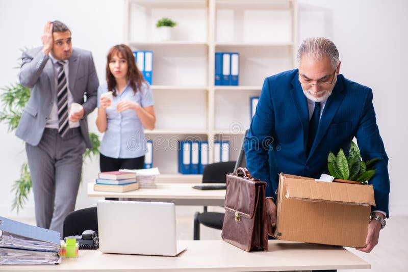 Two Male and One Female Employees Working in the Office Stock Image ...