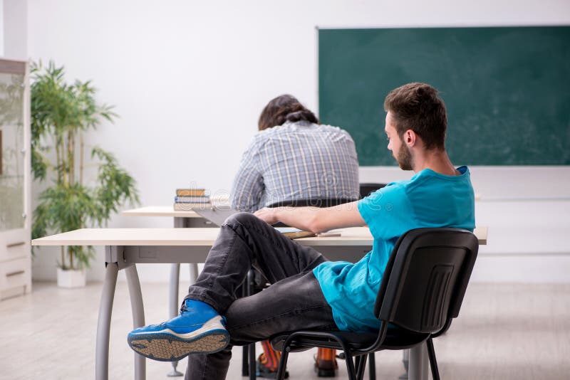 Two Male Pupils in Bullying Concept in the Classroom Stock Image ...