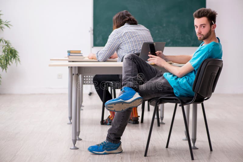 Two Male Pupils in Bullying Concept in the Classroom Stock Photo ...