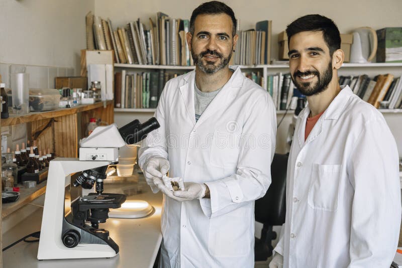 Two Male Scientists Looking at Camera and Smiling in Lab Coat Stock ...