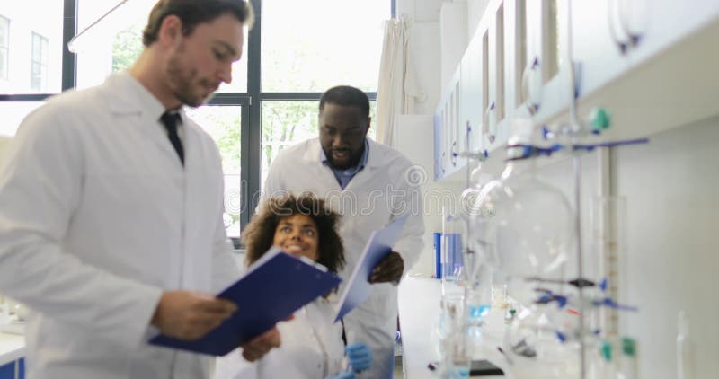 Two Male Scientists Professors Walking in Laboratory Controlling Work ...