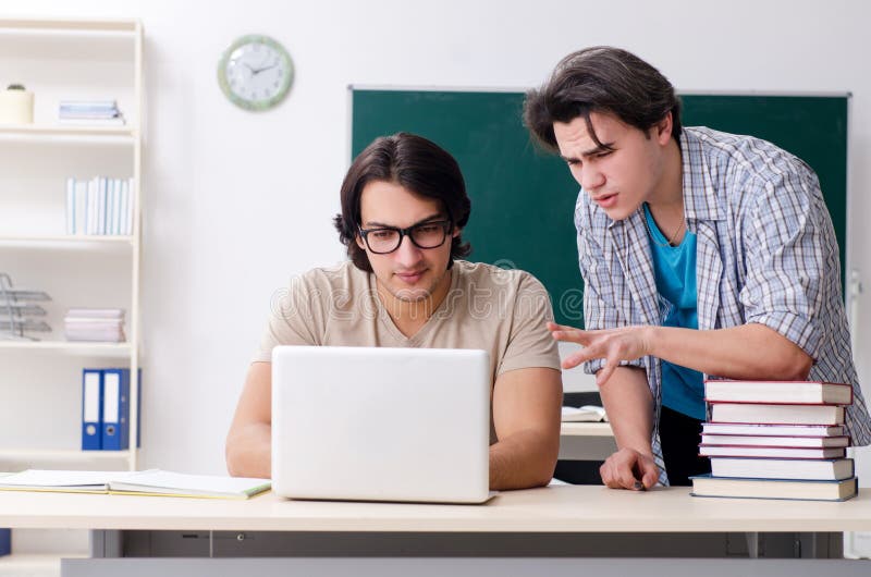 The Two Male Students in the Classroom Stock Image - Image of ...