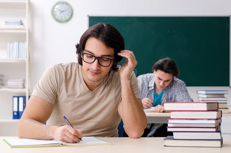 The Two Male Students in the Classroom Stock Photo - Image of ...