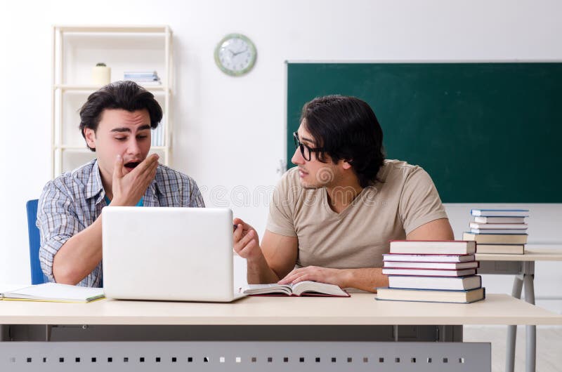 The Two Male Students in the Classroom Stock Image - Image of ...