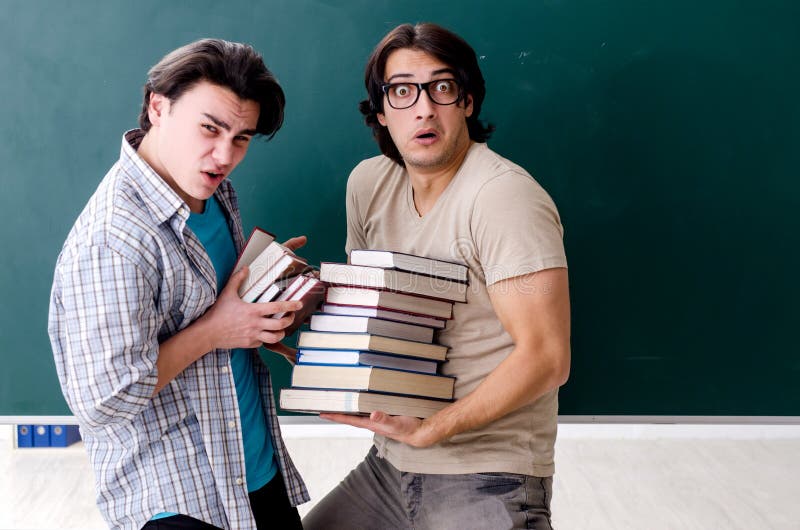 Two Male Students in the Classroom Stock Photo - Image of panic ...