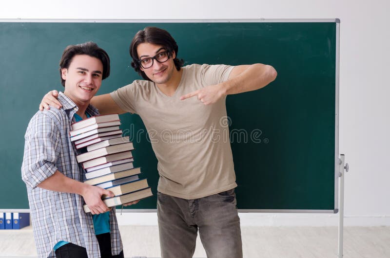 Two Male Students in the Classroom Stock Image - Image of board ...
