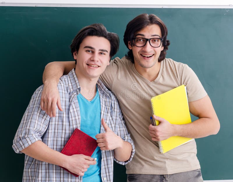 Two Male Students in the Classroom Stock Image - Image of hardworking ...