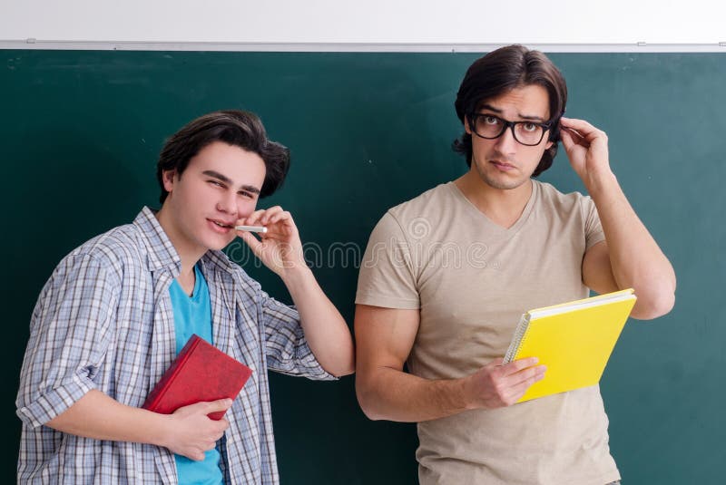 Two Male Students in the Classroom Stock Photo - Image of college, back ...