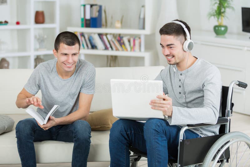 Two Male Students Going Over Their Homework Stock Photo - Image of ...