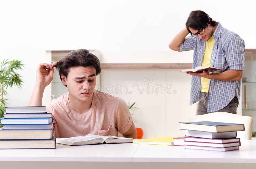 Two Male Students Preparing for Exams at Home Stock Photo - Image of ...