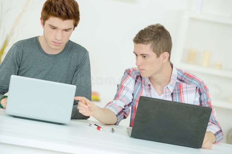 Two Male Students Using Laptops Stock Photo - Image of friend ...