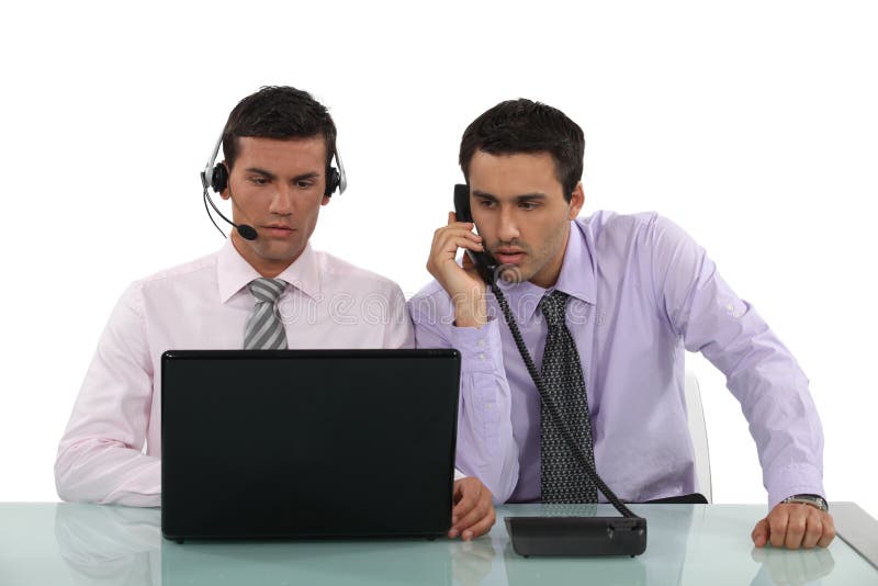 Two Male Telephone Operatives Stock Photo - Image of intelligent ...