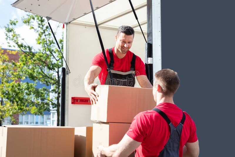 Two Male Worker Loading the Cardboard Boxes in Moving Truck Stock Image ...