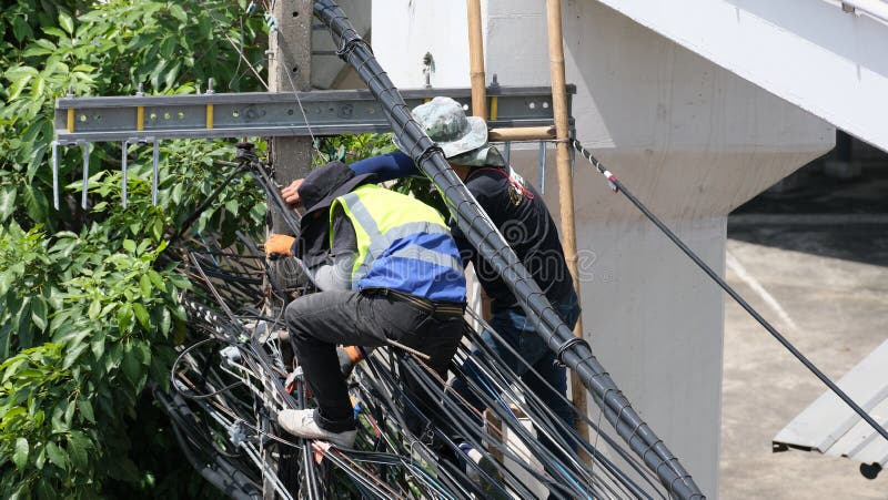 Two Male Workers Work on Cables Editorial Stock Photo - Image of repair ...