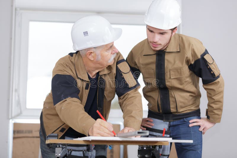 Two Male Workers Working on Workbench Stock Image - Image of craftsman ...