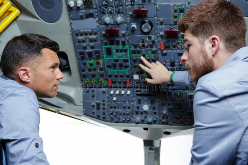 Two Males in Cockpit Discussing about Commands Stock Image - Image of ...