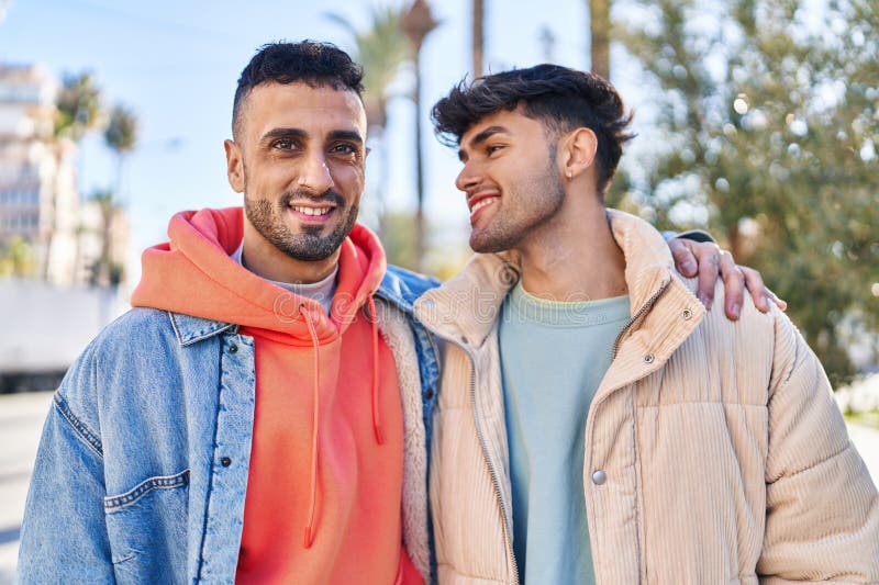 Two Man Couple Hugging Each Other Standing at Street Stock Photo ...