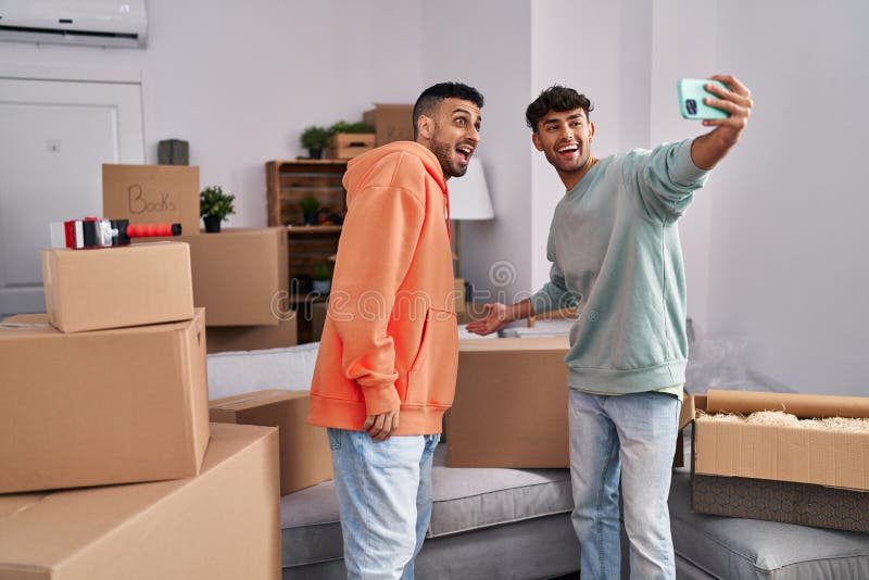 Two Man Couple Make Selfie by Smartphone at New Home Stock Photo ...