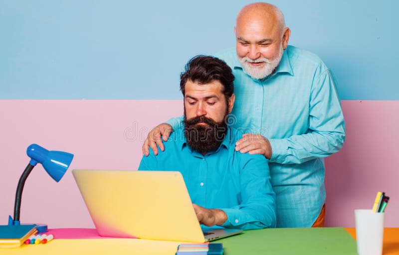 Two Man in Different Ages Working in Office. Old Manager Having ...