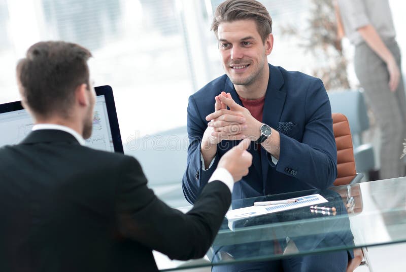 Two Men Discuss the Growth of the Company, Looking at the Rising Graph ...