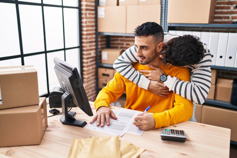 Two Man Ecommerce Business Workers Hugging Each Other Working at Office ...